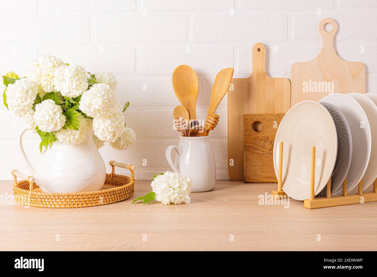 A beautiful kitchen backdrop with various kitchen utensils and a jug ...