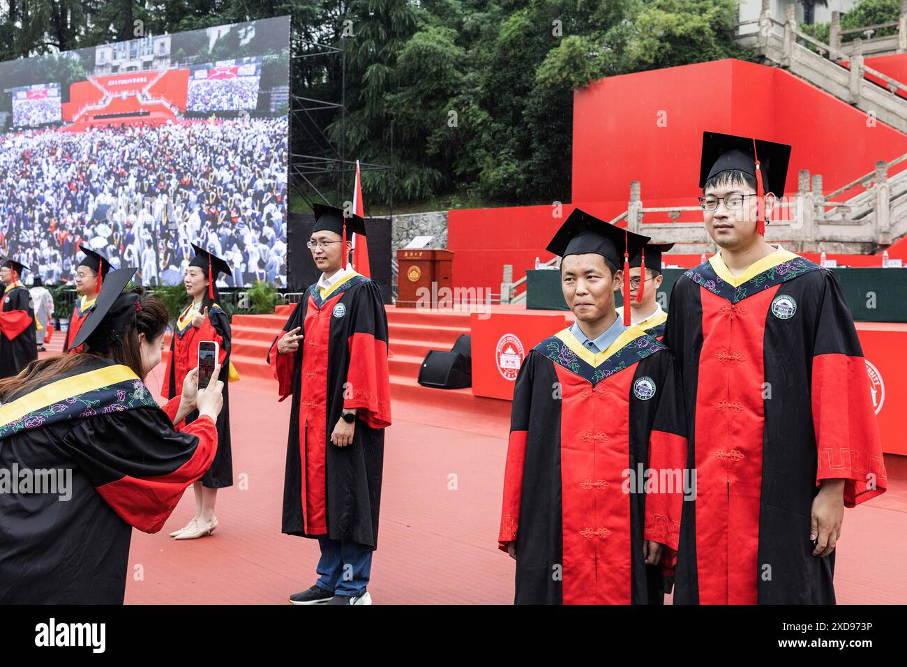 Wuhan, China. 20th June, 2024. Students pose for photos in front of the ...