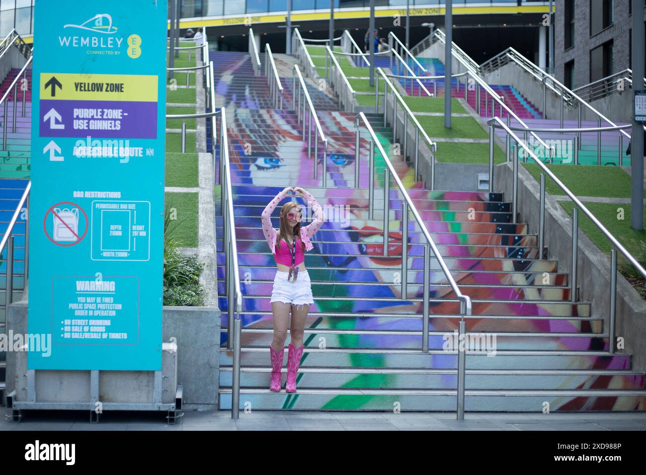 A fan poses on the Swiftie Steps at Wembley Stadium in London, ahead of ...
