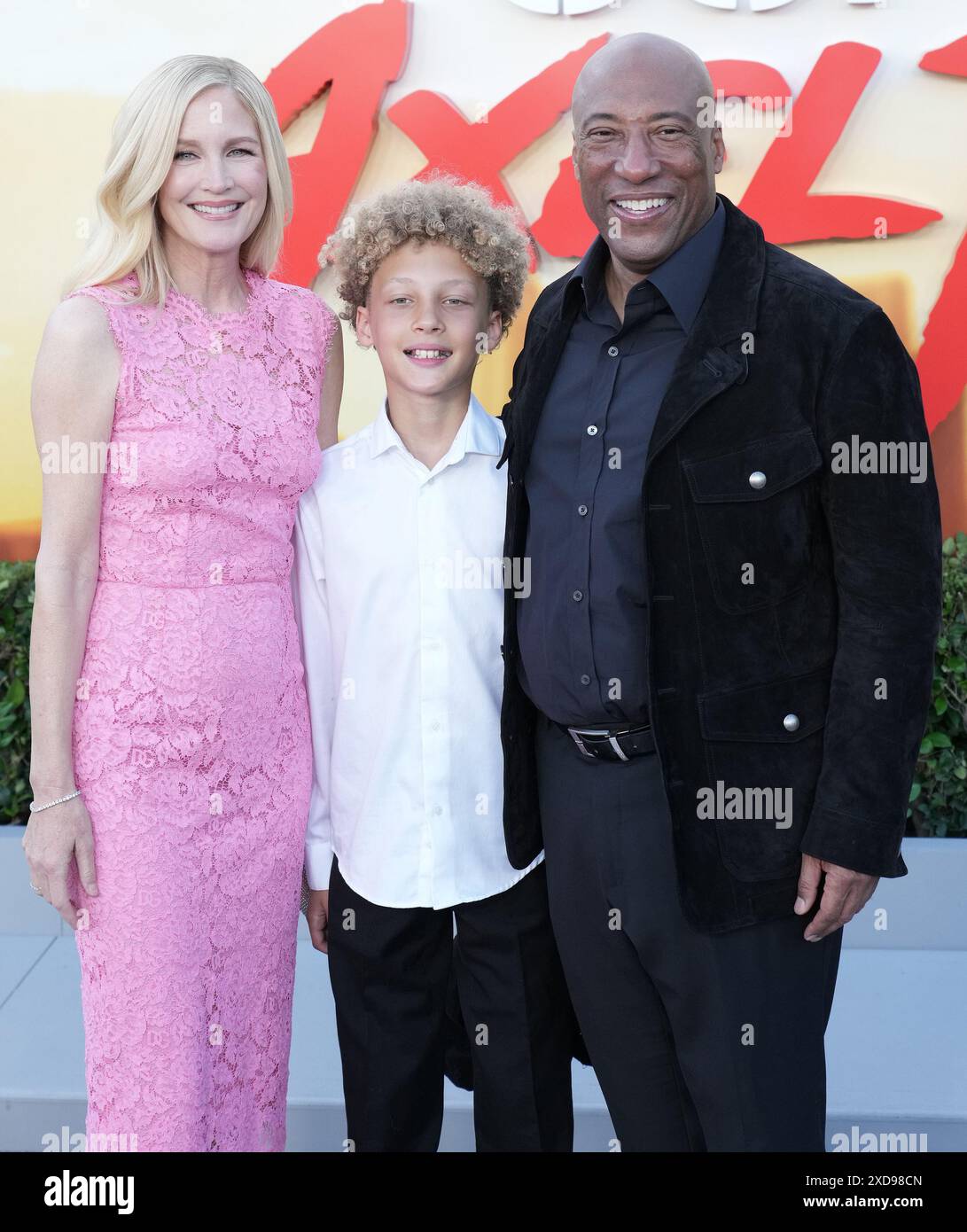 (L-R) Jennifer Lucas, Son and Byron Allen at the BEVERLY HILLS COP ...