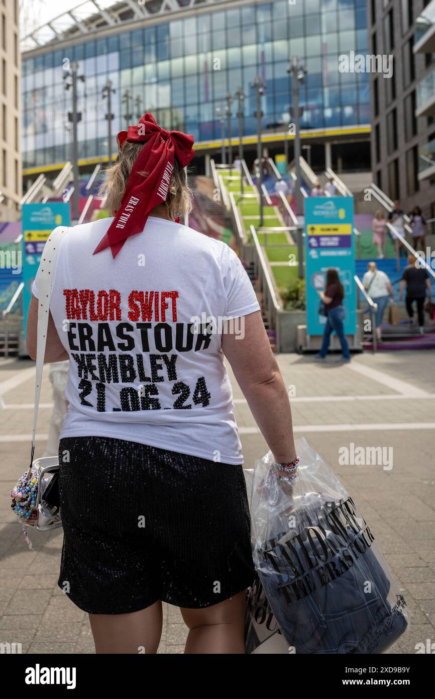 London, UK. 21 June 2024. A Swiftie fan wears a tour T shirt. Taylor ...