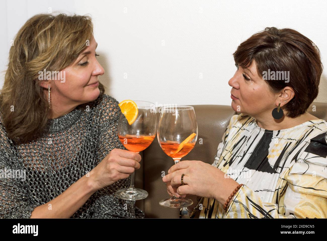 Two female friends enjoying an aperitif. Banquet, restaurant, feast ...