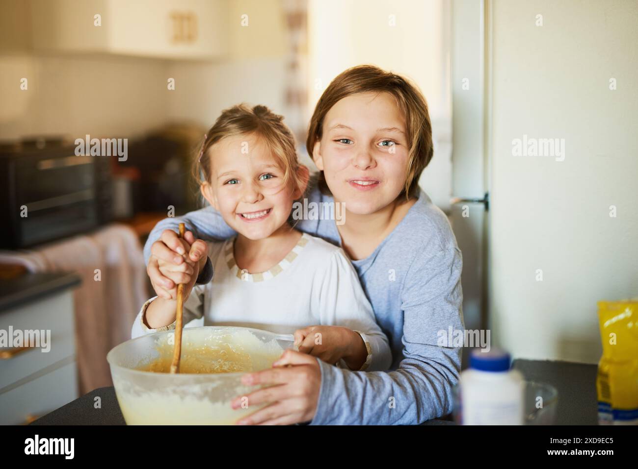 Kitchen, siblings and girl learning to bake in home for cookies ...