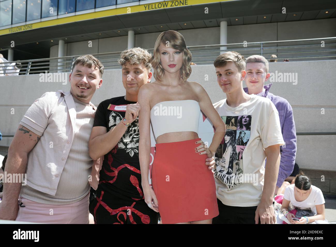 Fans wait outside Wembley Stadium in London, ahead of Taylor Swift's ...