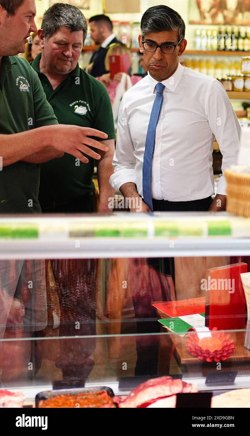 Prime Minister Rishi Sunak talking to staff during a visit to a Farm ...