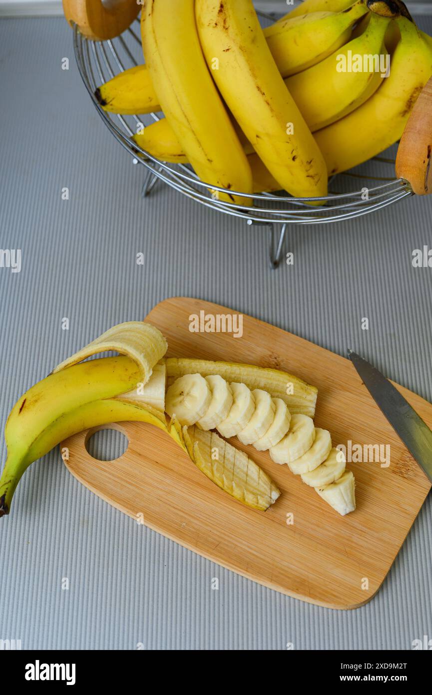 Cutting peeled banana kitchen hi-res stock photography and images - Alamy