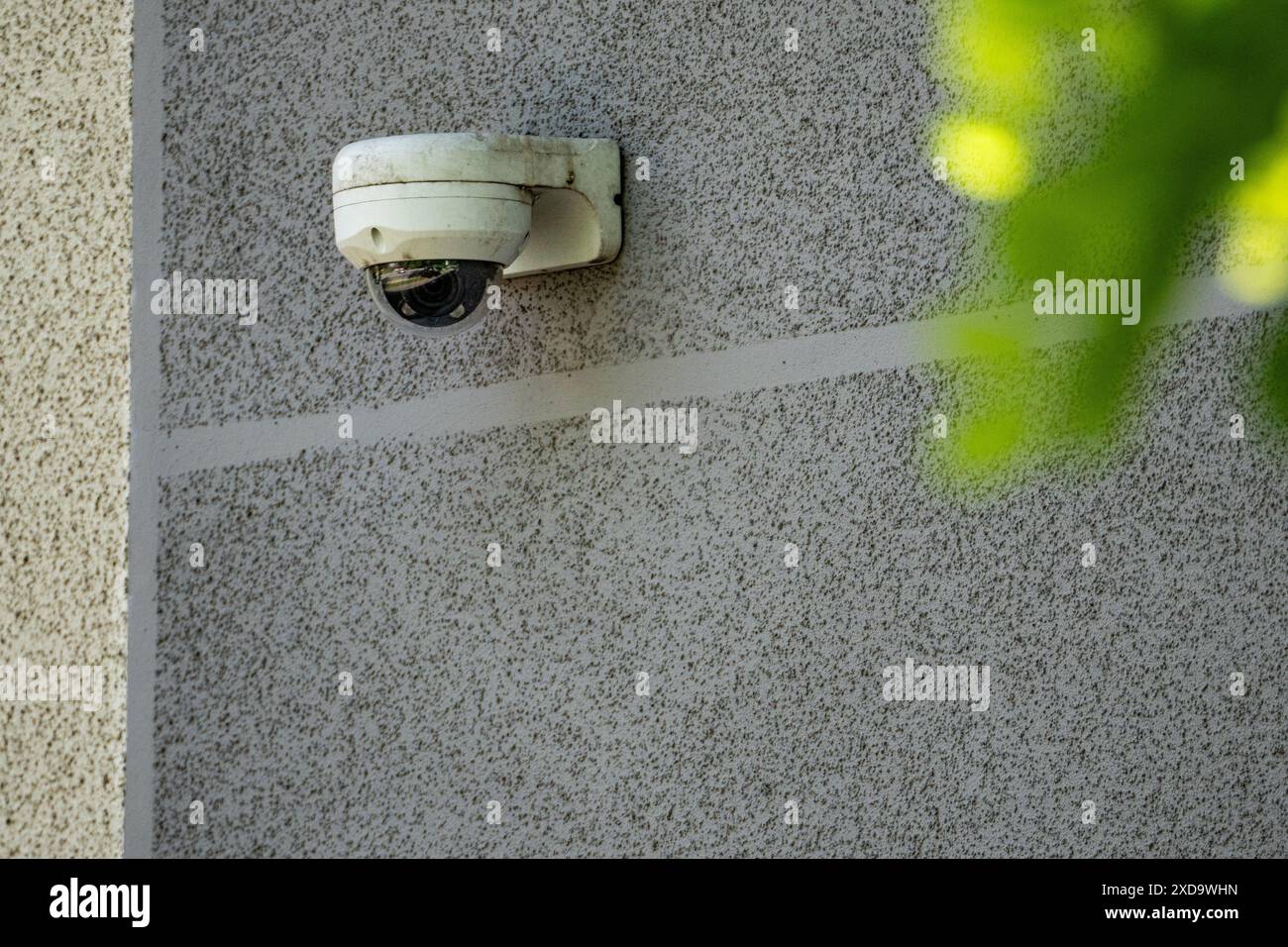 White Security Camera Mounted On Exterior Wall Of Building Stock Photo ...