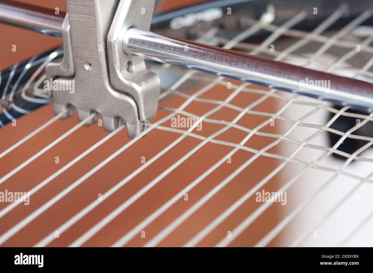 Tennis Racket in Stringing Machine Being Repaired Stock Photo - Alamy