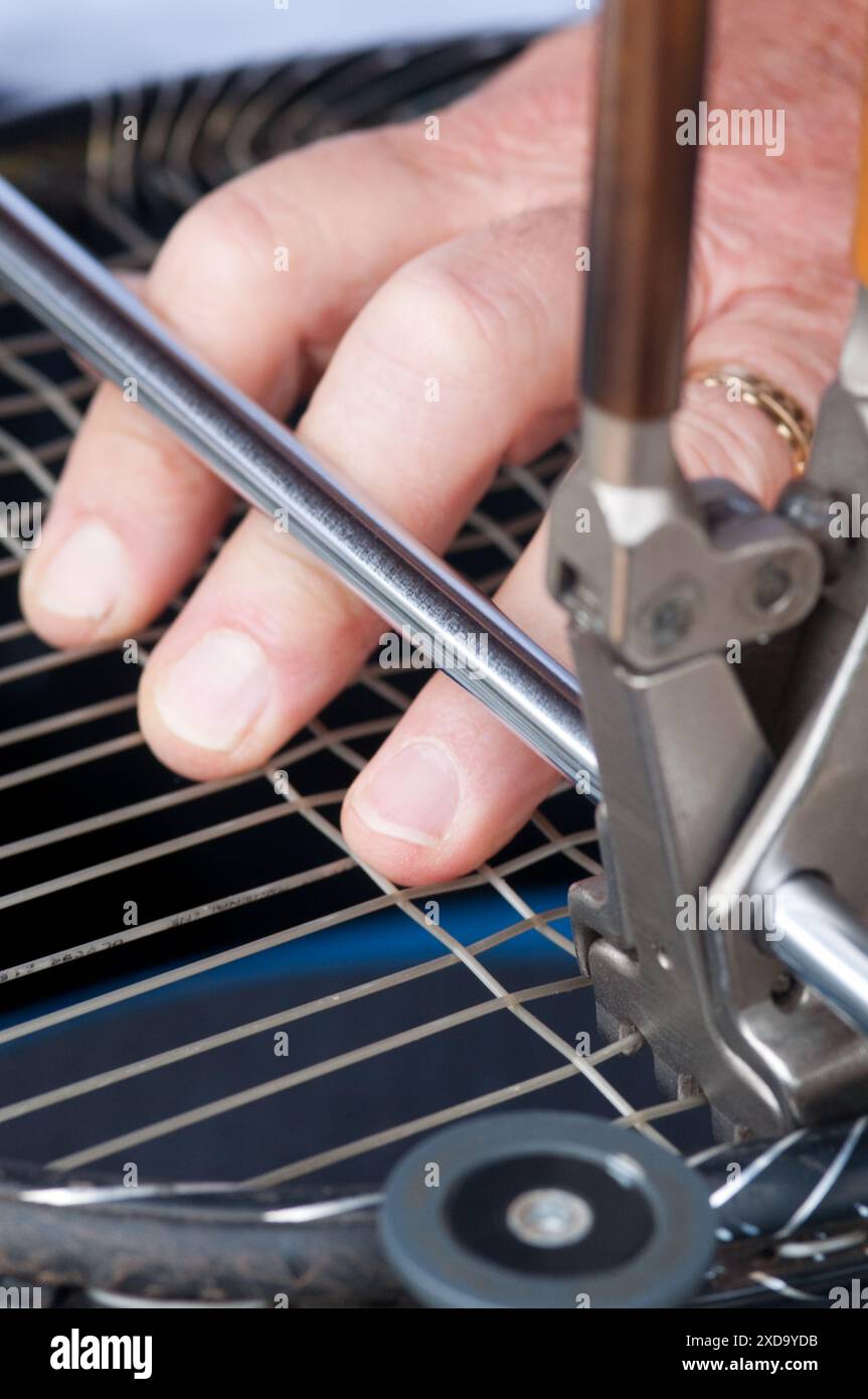 Tennis Racket in Stringing Machine Being Repaired Stock Photo - Alamy