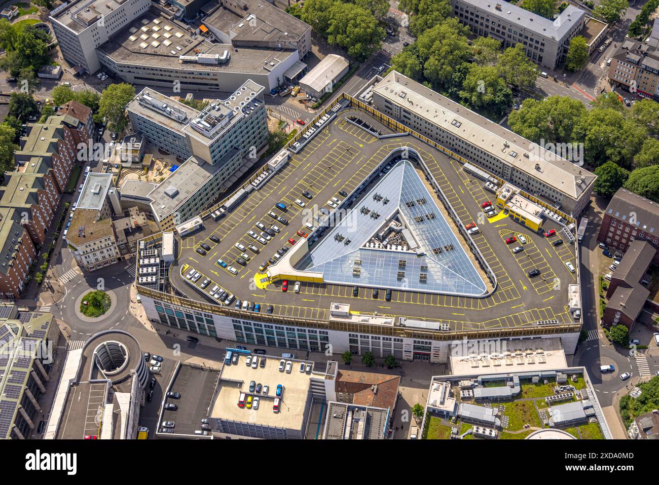 Triangular building with parking deck and glass dome hi-res stock ...