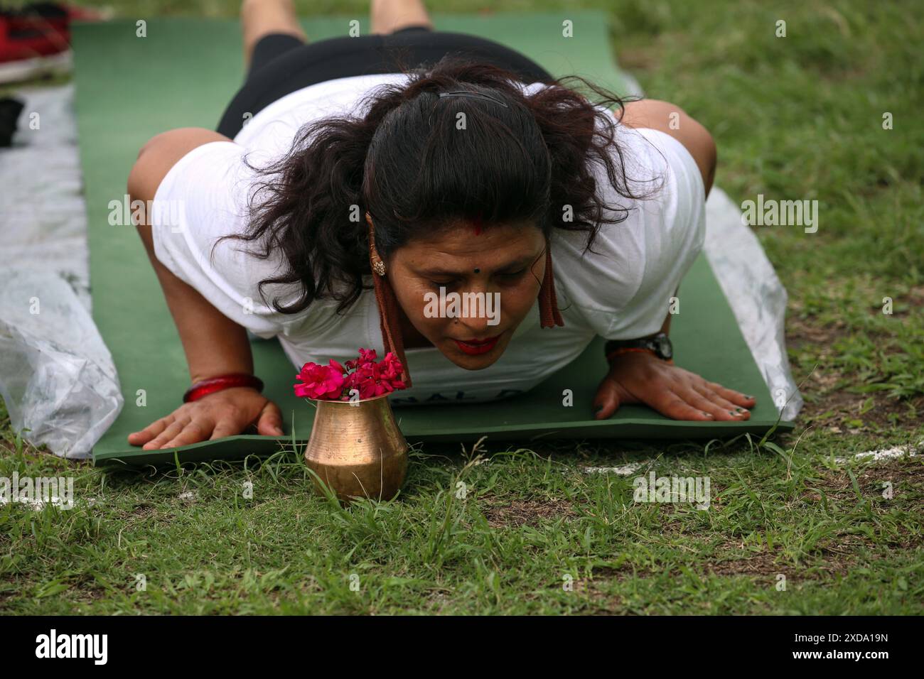June 21, 2024: A woman performs yoga steps on the International Yoga Day in Kathmandu, Nepal on ...