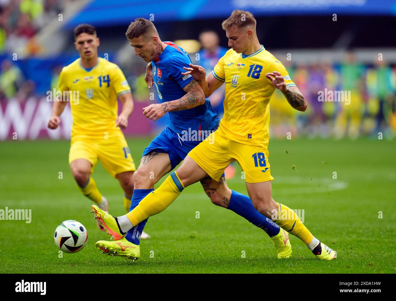 Ukraine's Volodymyr Brazhko (right) and Slovakia's Juraj Kucka battle ...
