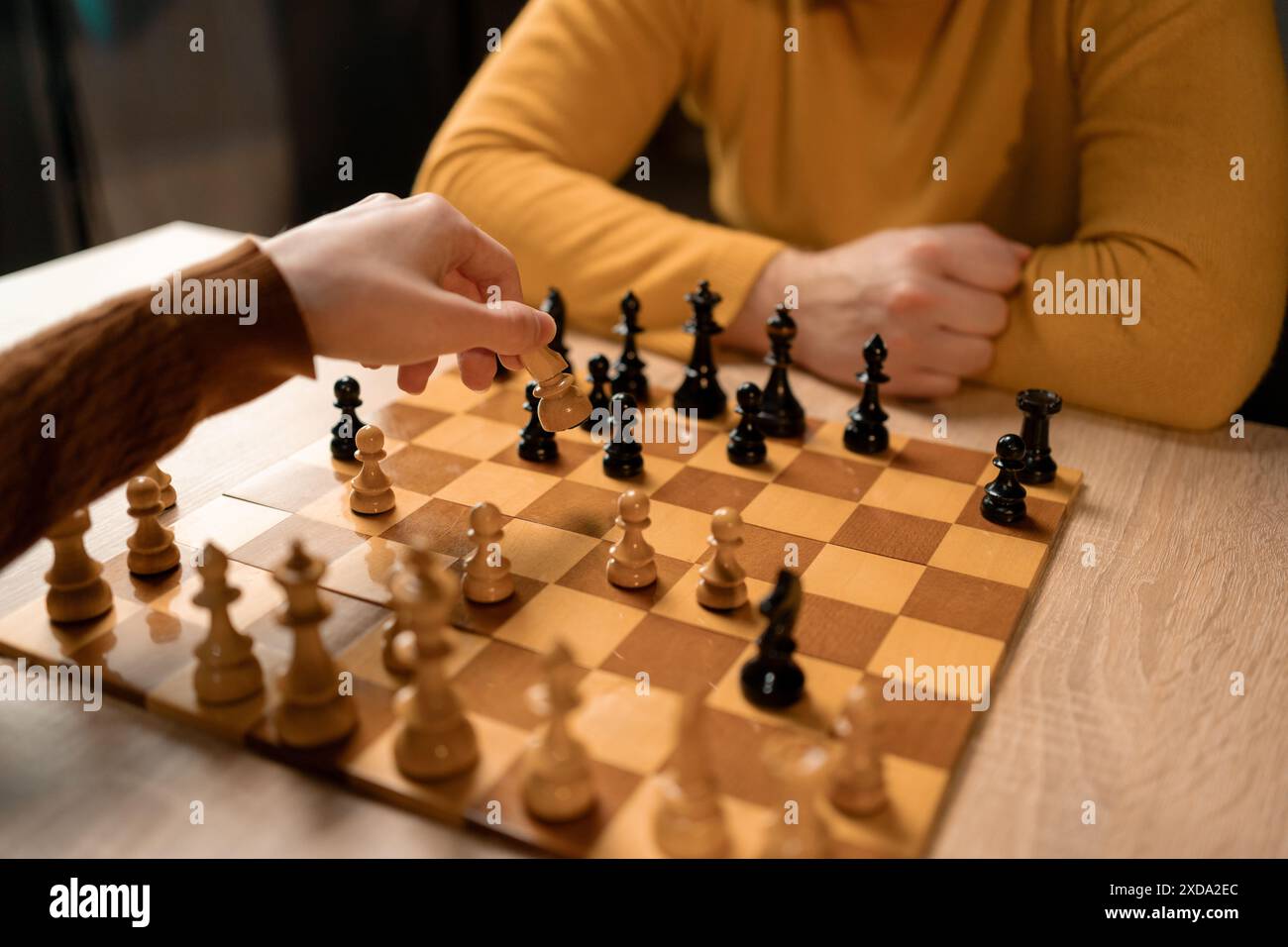 man moving chess piece on chess board game concept for ideas and ...