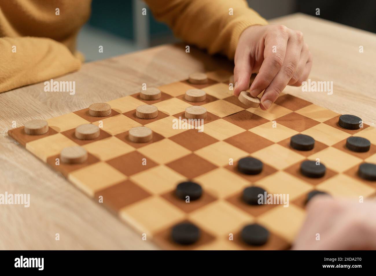 checkerboard with white and black checkers. checkers on playing field ...