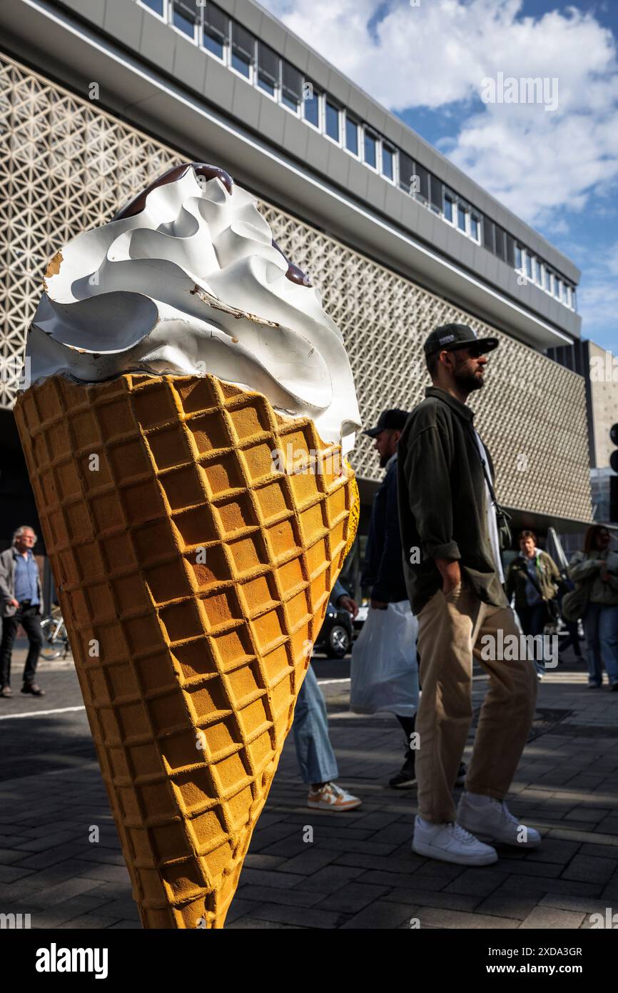 large ice cream cone as an advertisement in front of an ice cream ...