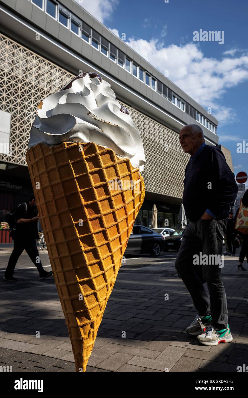 large ice cream cone as an advertisement in front of an ice cream ...