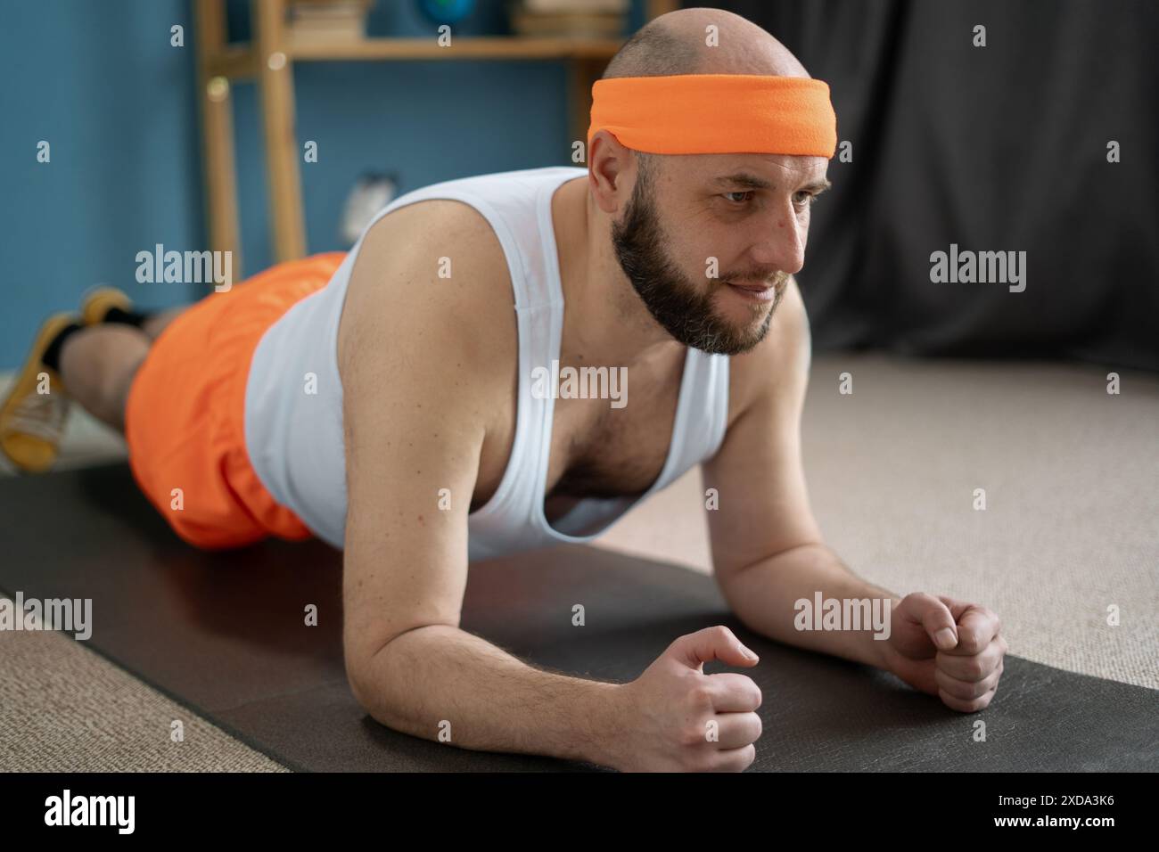 Middle aged man makes an exercise plank. Healthy lifestyle concept ...