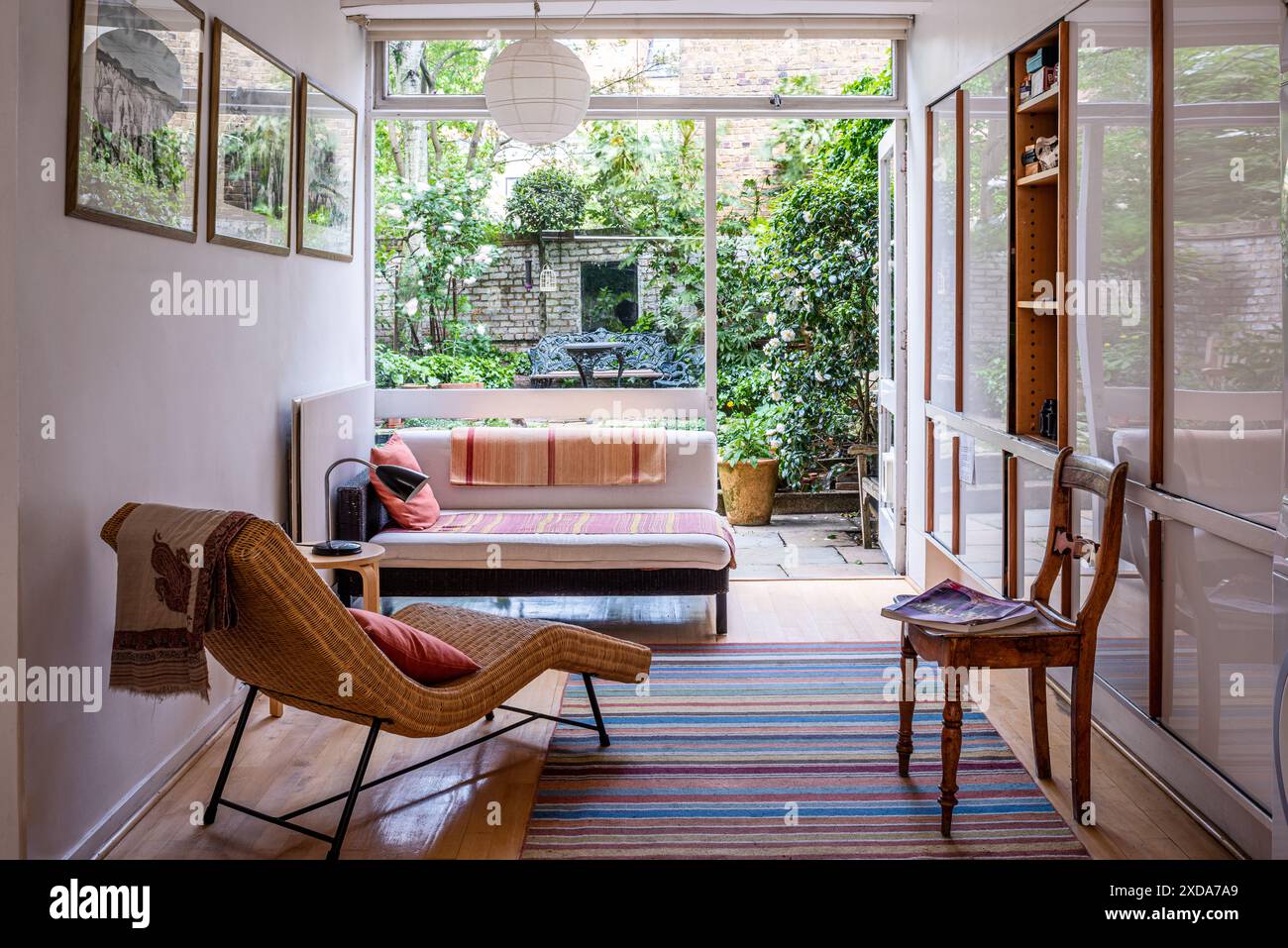 Rattan recliner from Habitat in garden room of Grade II listed ...
