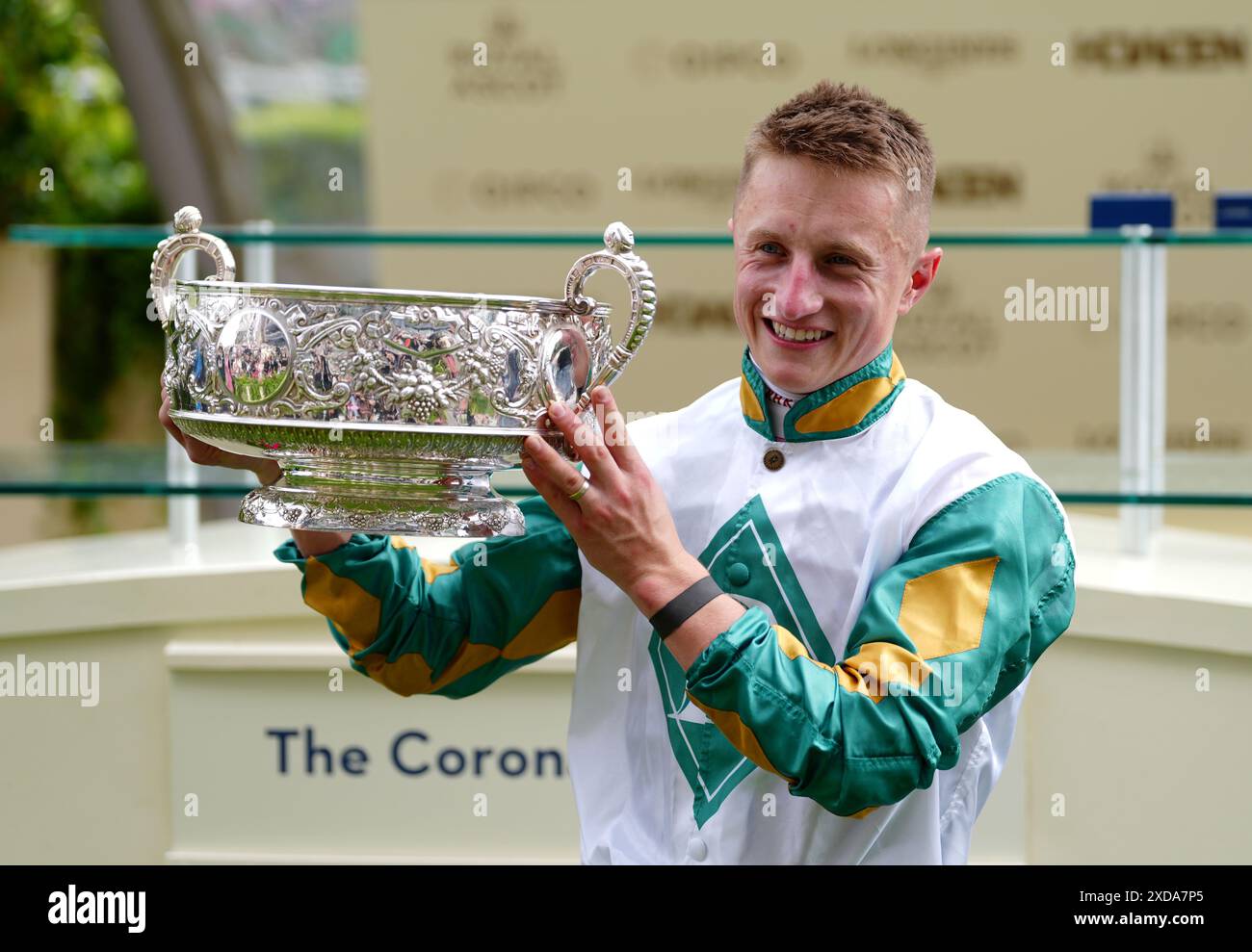 Jockey Tom Marquand poses with the trophy after winning the Coronation ...