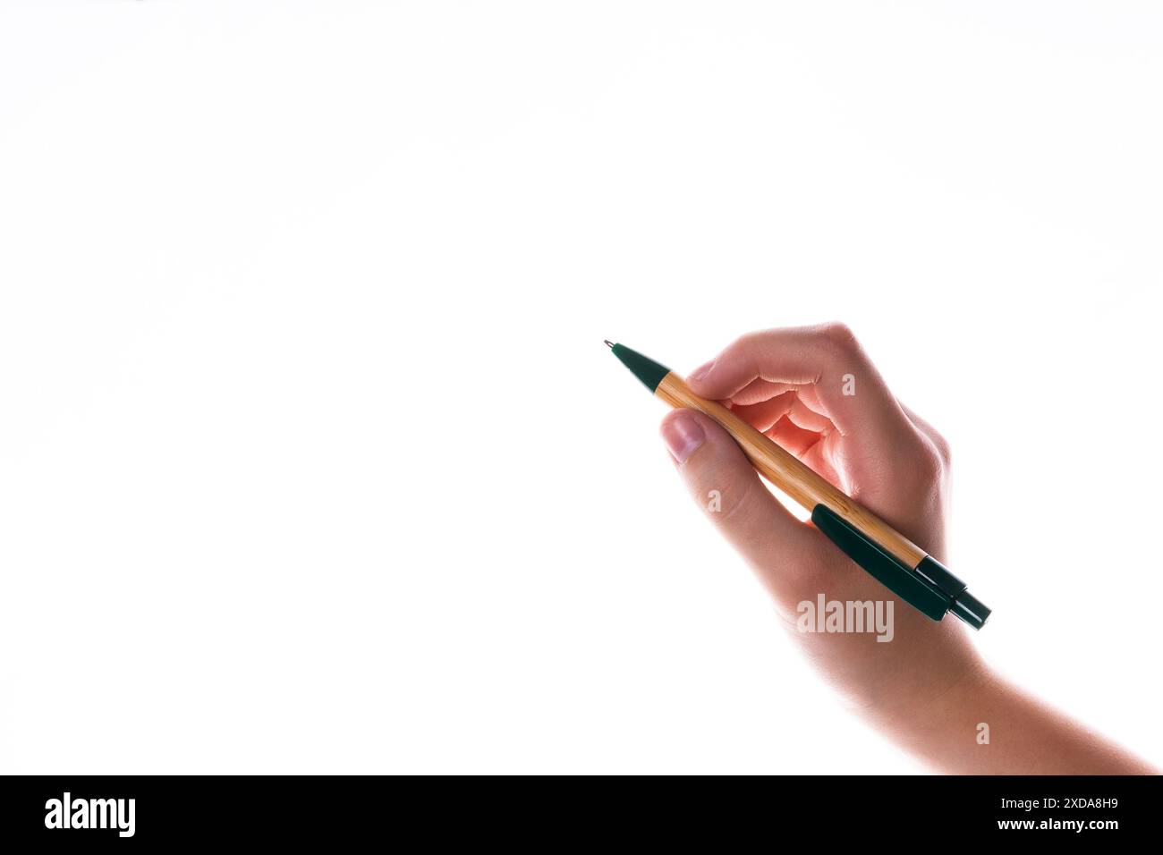 Children hand with pen write on an blue white background. Writing hand ...