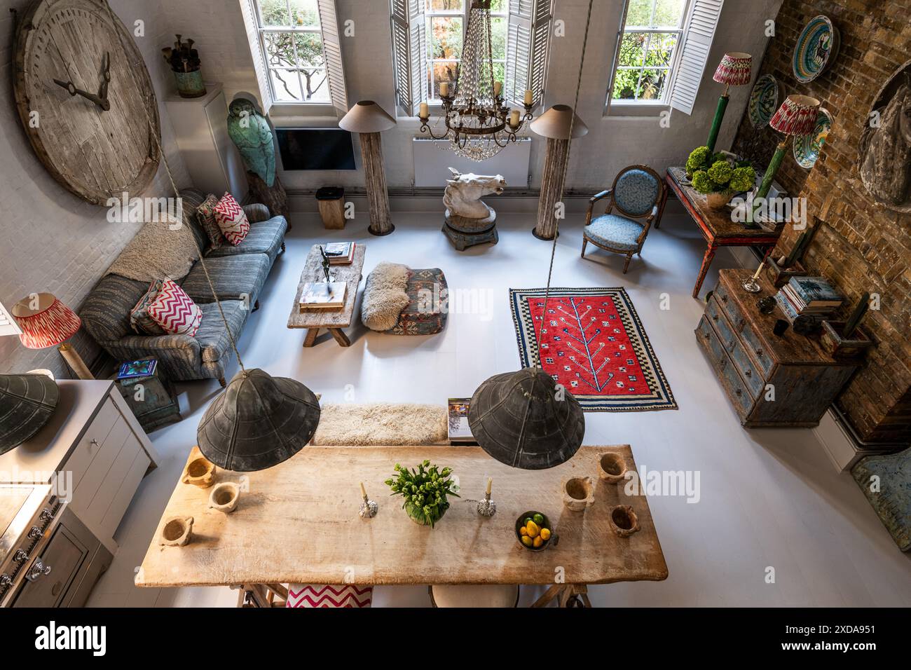 Elevated view of lofty double height living room with statement ...