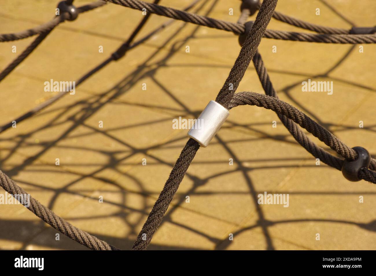 A close-up shot of elements of a rope structure on the child playground ...