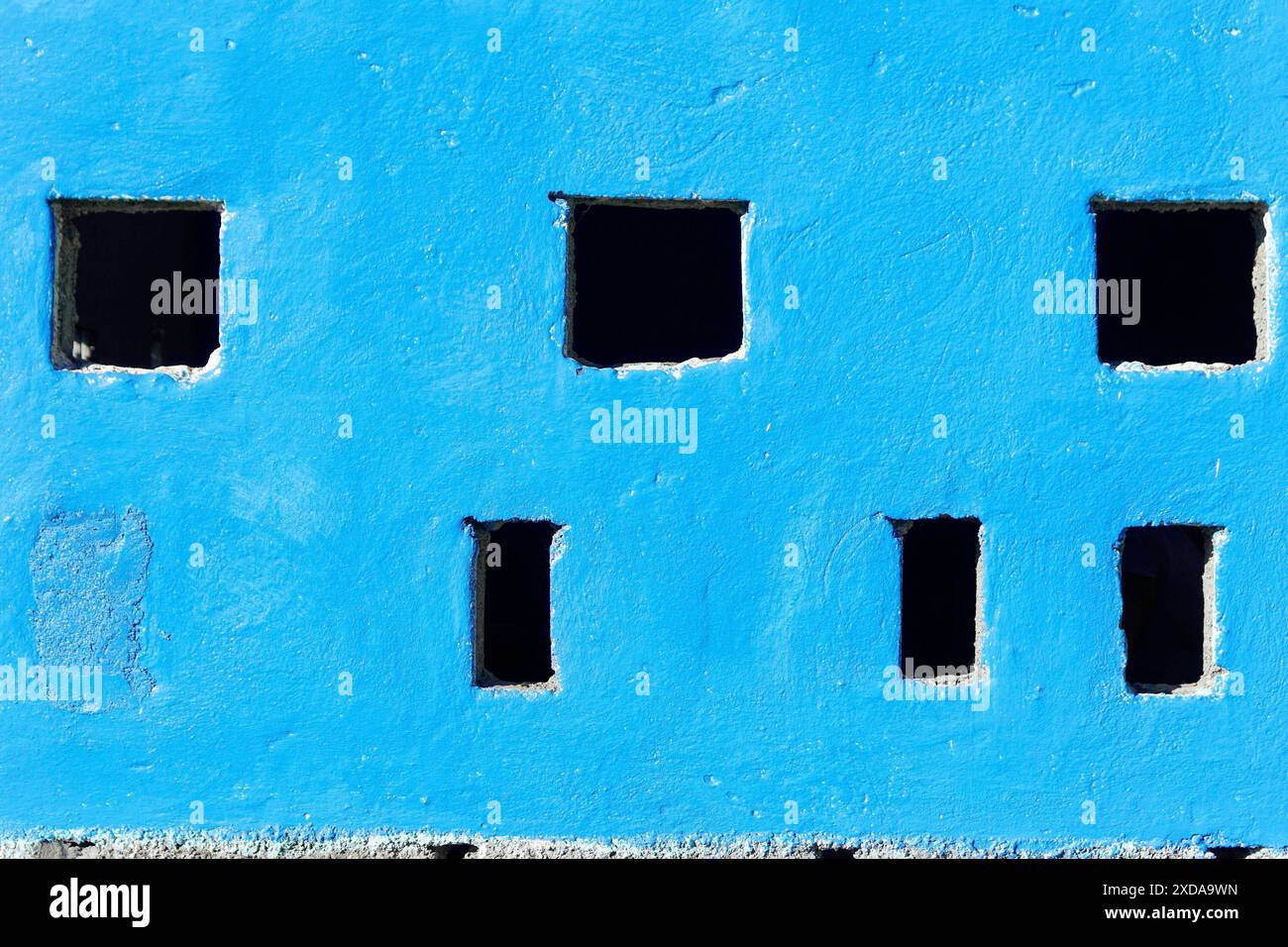 Cuba, Cuba, Central America, Blue wall with several rectangular window ...