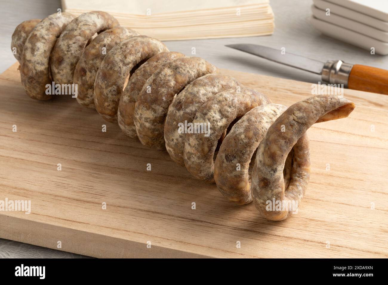Traditional French Tortillons sausage on a cutting board close up Stock ...