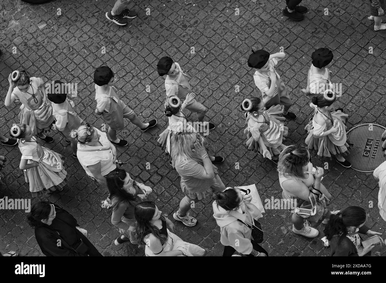 Monochrome children from a local school parading in unique traditional ...