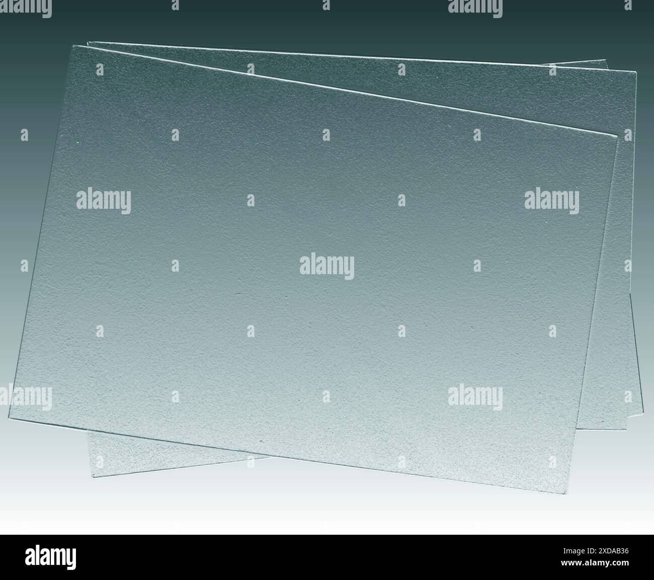 Two transparent sheets of glass with a textured surface, slightly ...