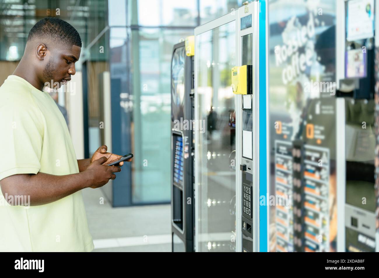Person using modern vending hi-res stock photography and images - Alamy
