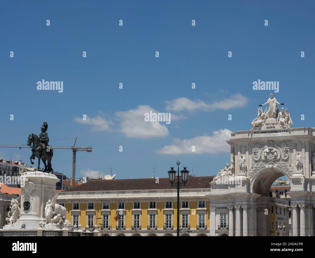 Large square with an equestrian statue and a monumental archway in ...