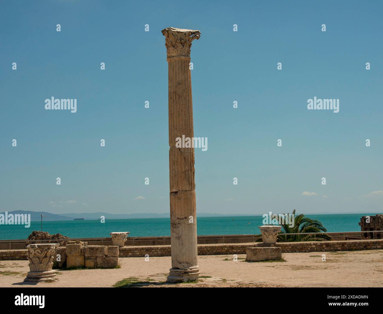 Lonely ancient column with sea view and a vast coastline in the ...