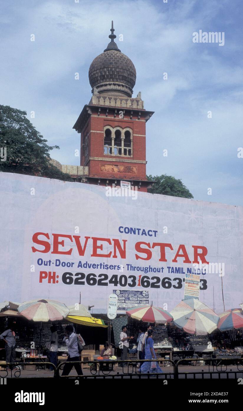 a street market in front of a advertising of Seven Star in the city of ...