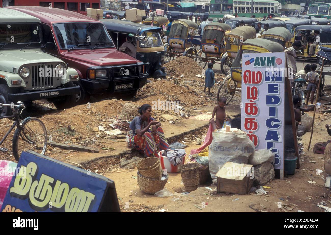 poor people and children with some food in front of a medical store on ...