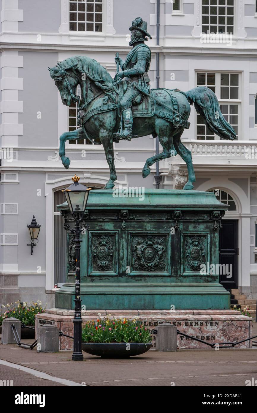 Bronze equestrian statue on a square in front of a historic building ...