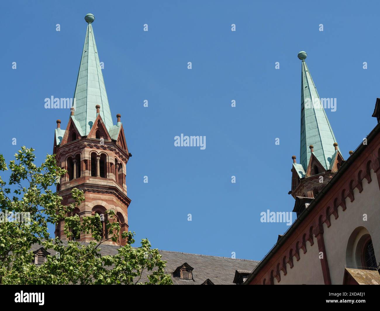 Close-up of two gothic church towers in front of a clear blue sky ...