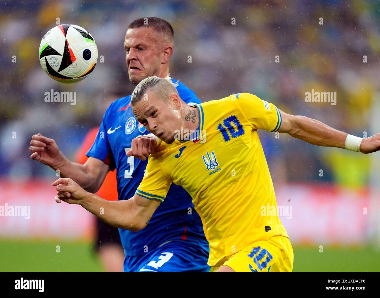 Ukraine's Mykhailo Mudryk (right) and Slovakia's Denis Vavro battle for ...