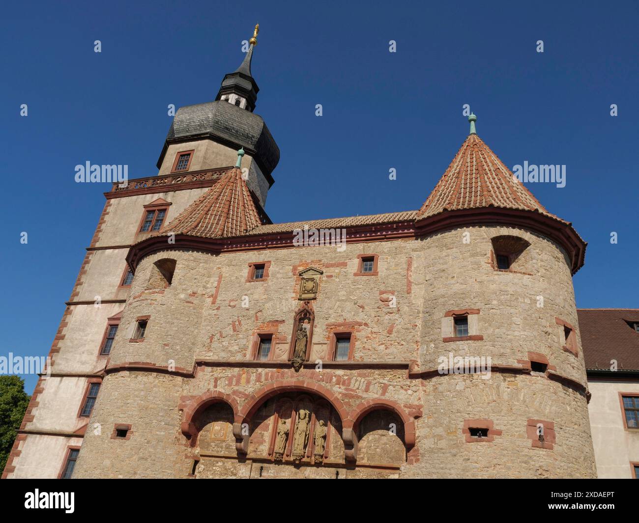 Mighty castle gate with high tower and historic architecture under a ...