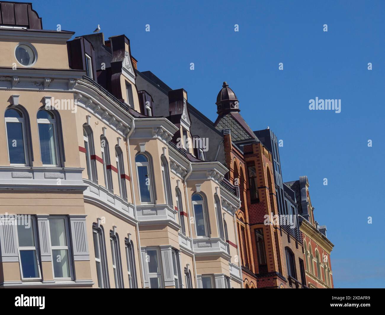 Row of historic buildings with ornate facades and windows under a ...