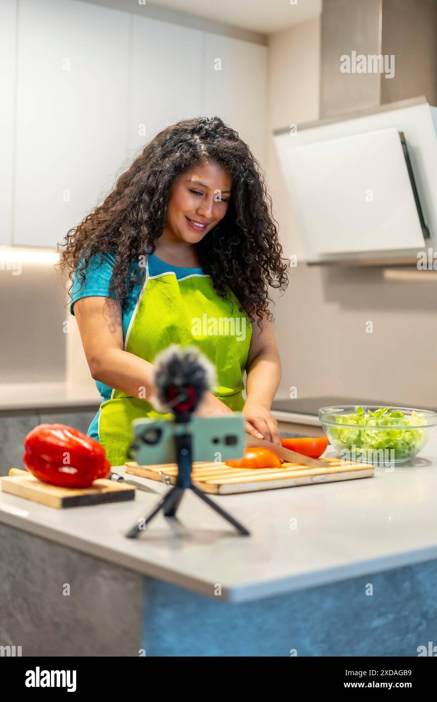 Vertical photo of a latin young female influencer recording a health ...
