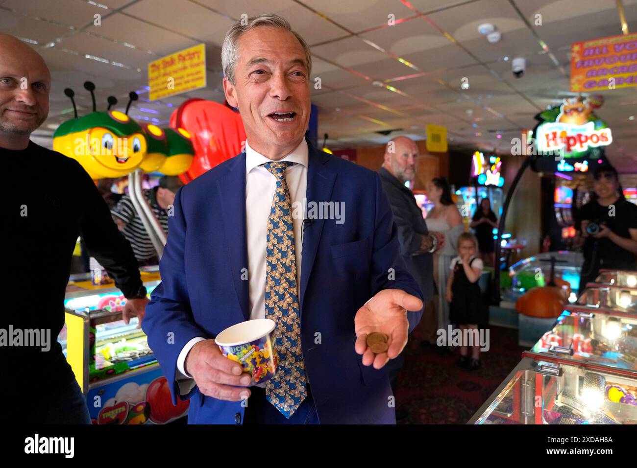 Britain's Nigel Farage, Reform UK party leader plays on a game in an ...