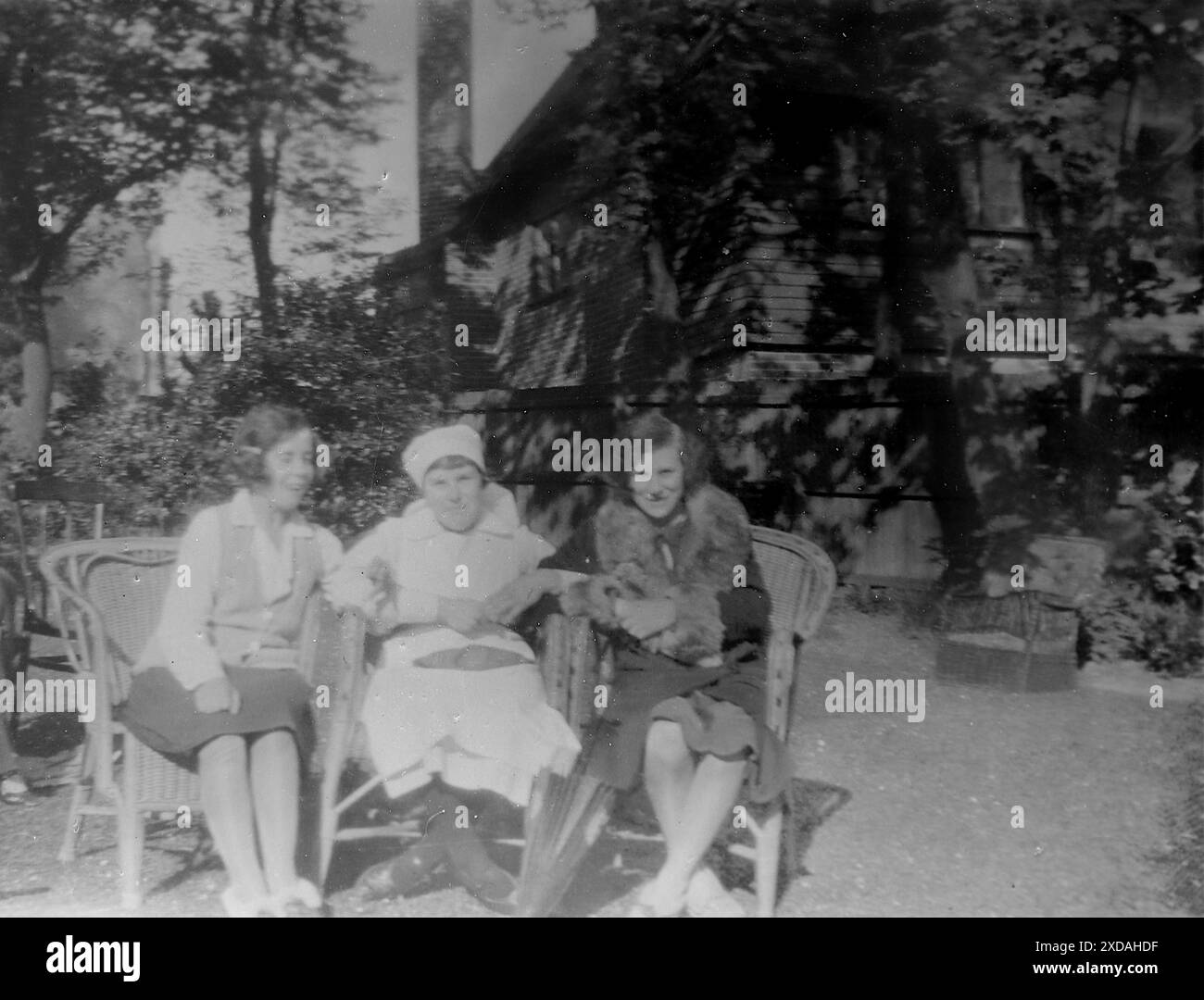 A group of three ladies on garden chairs, named as Alice, Edie and ...