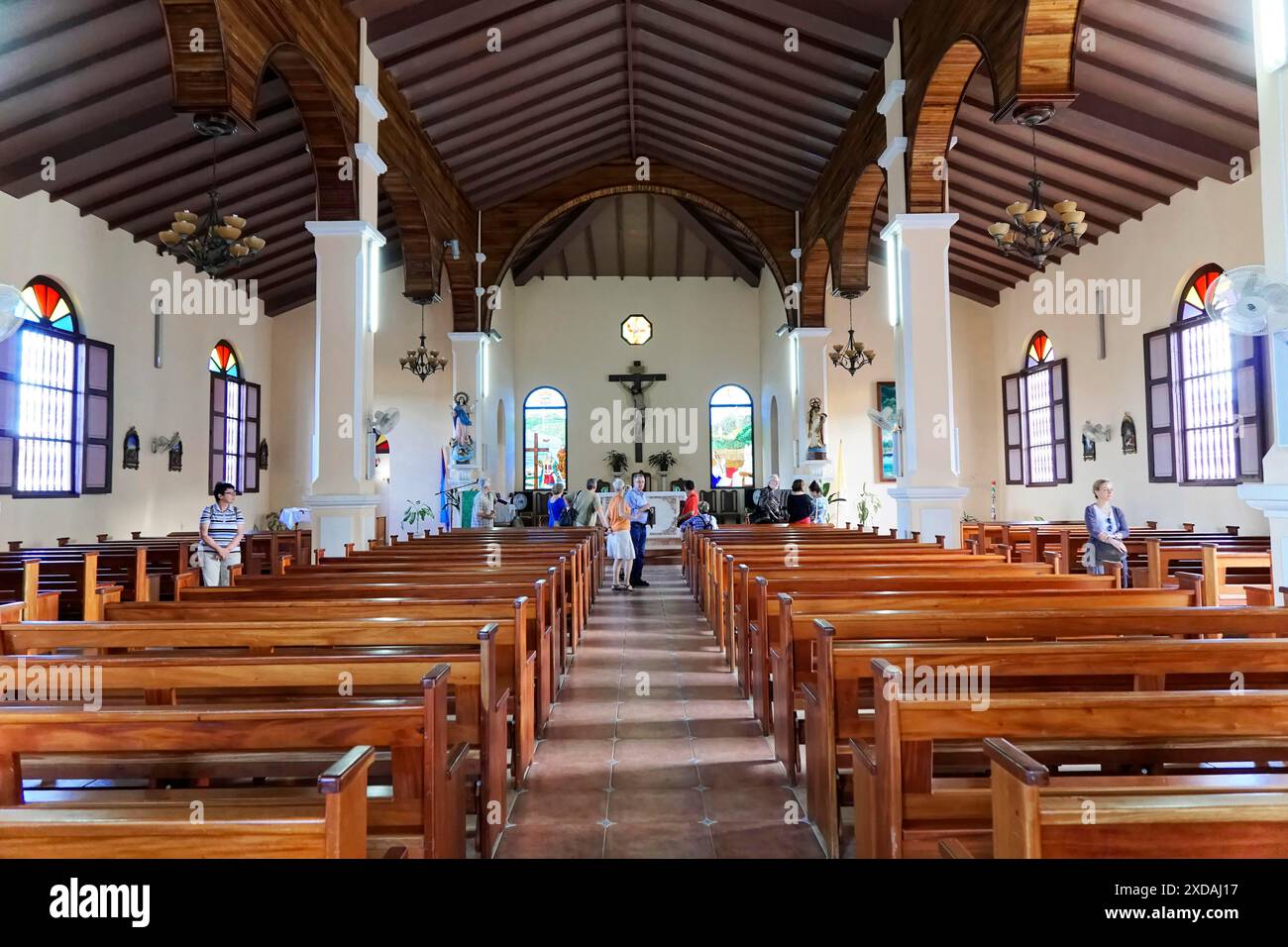 Cuba, Cuba, Central America, Interior of a church with wooden benches ...