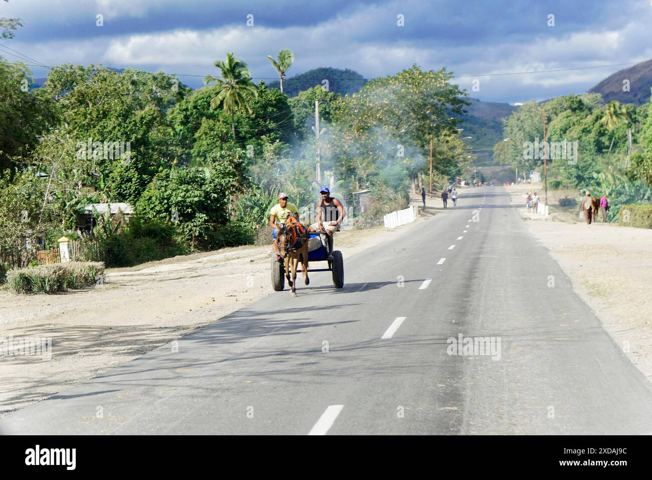 Santiago de Cuba, Cuba, Central America, Two people on a horse-drawn ...