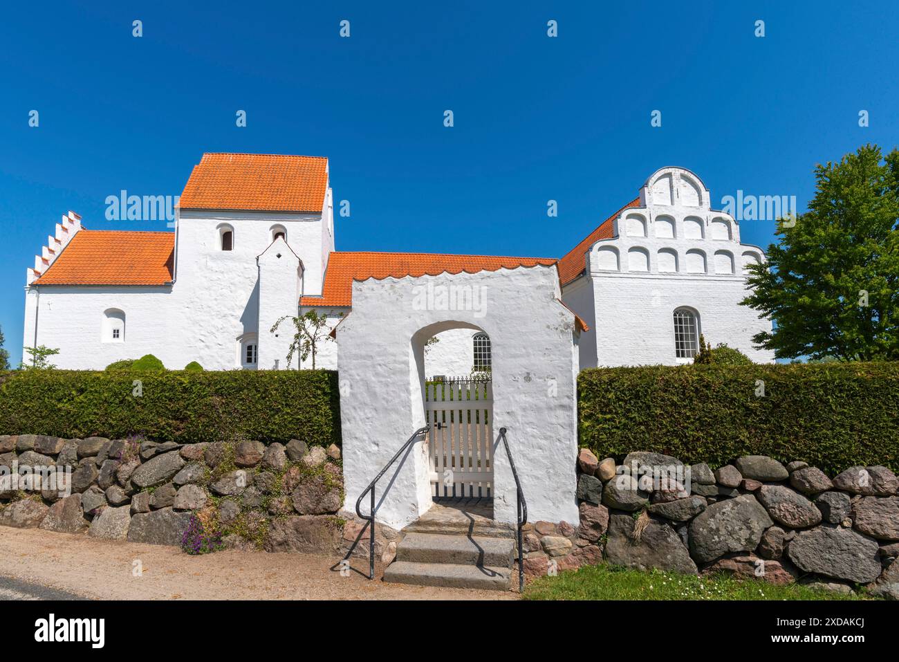 Typical Danish church with Renaissance gable in Hesselager, whitewashed ...