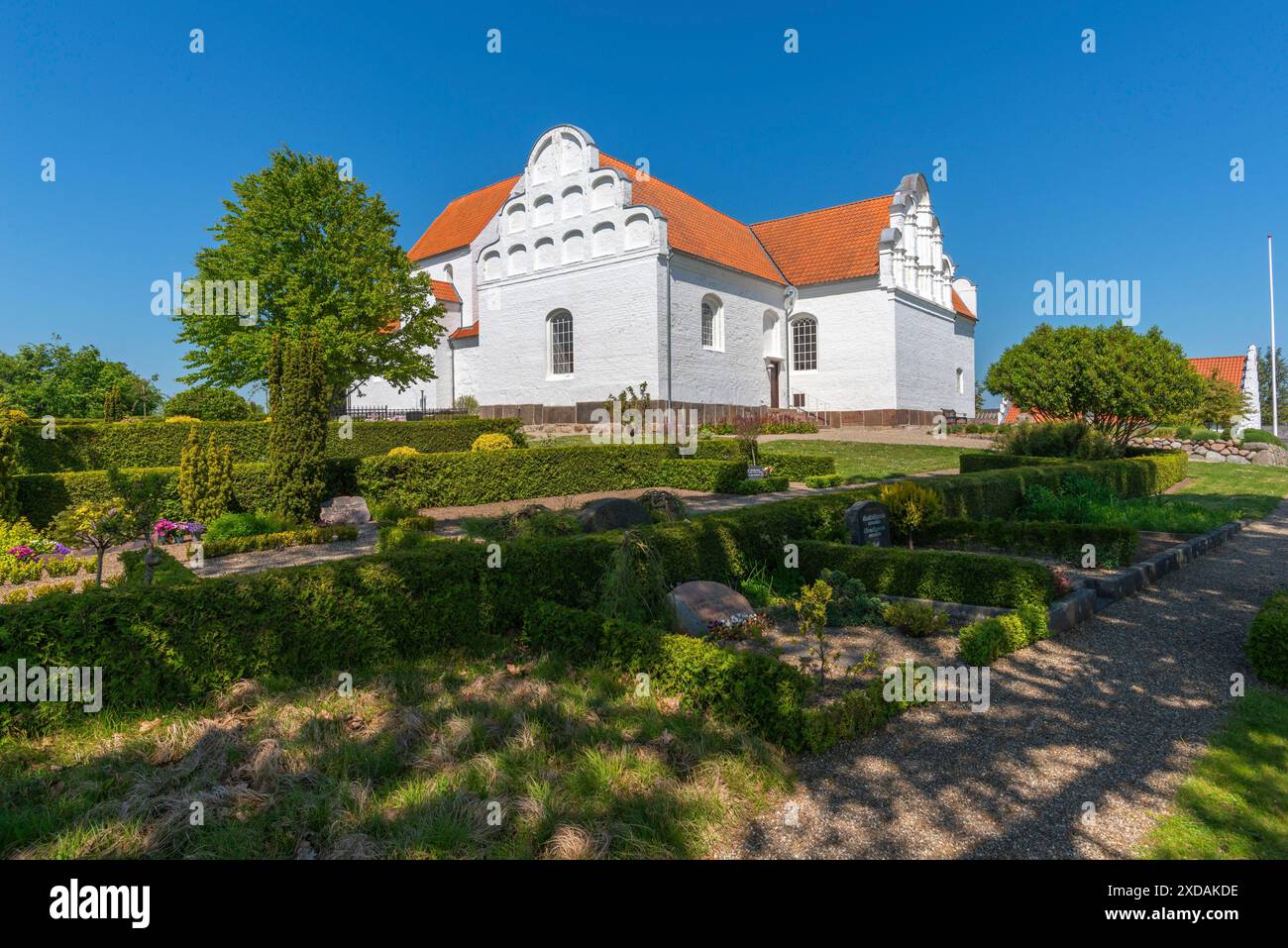Typical Danish church with Renaissance gable in Hesselager, whitewashed ...