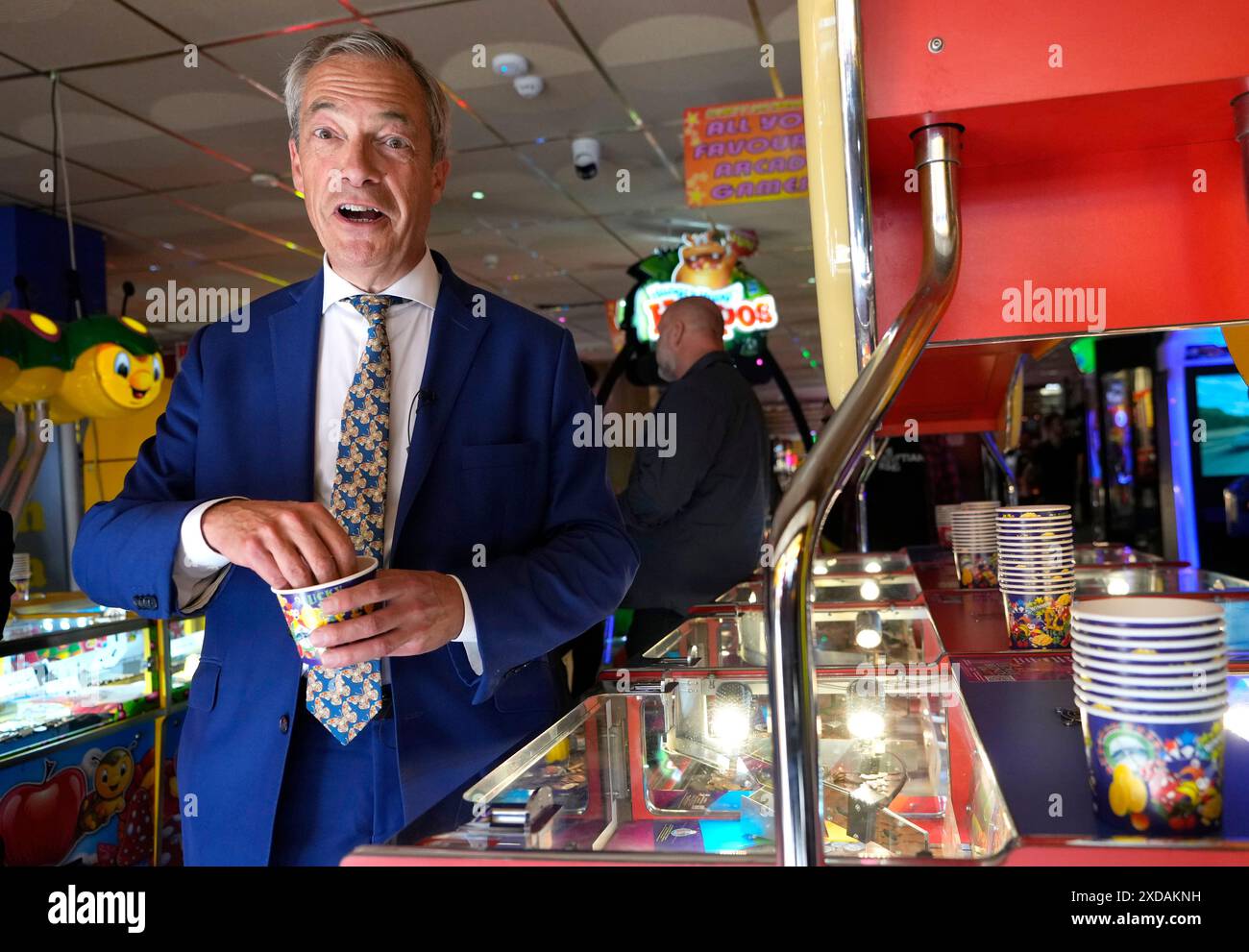 Britain's Nigel Farage, Reform UK party leader plays on a game in an ...