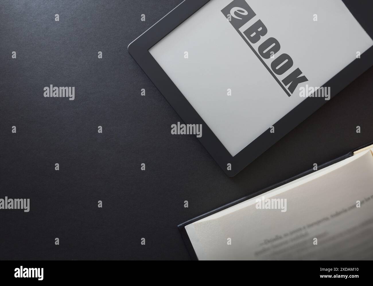 Detail of ebook with text written on screen isolated on black table ...