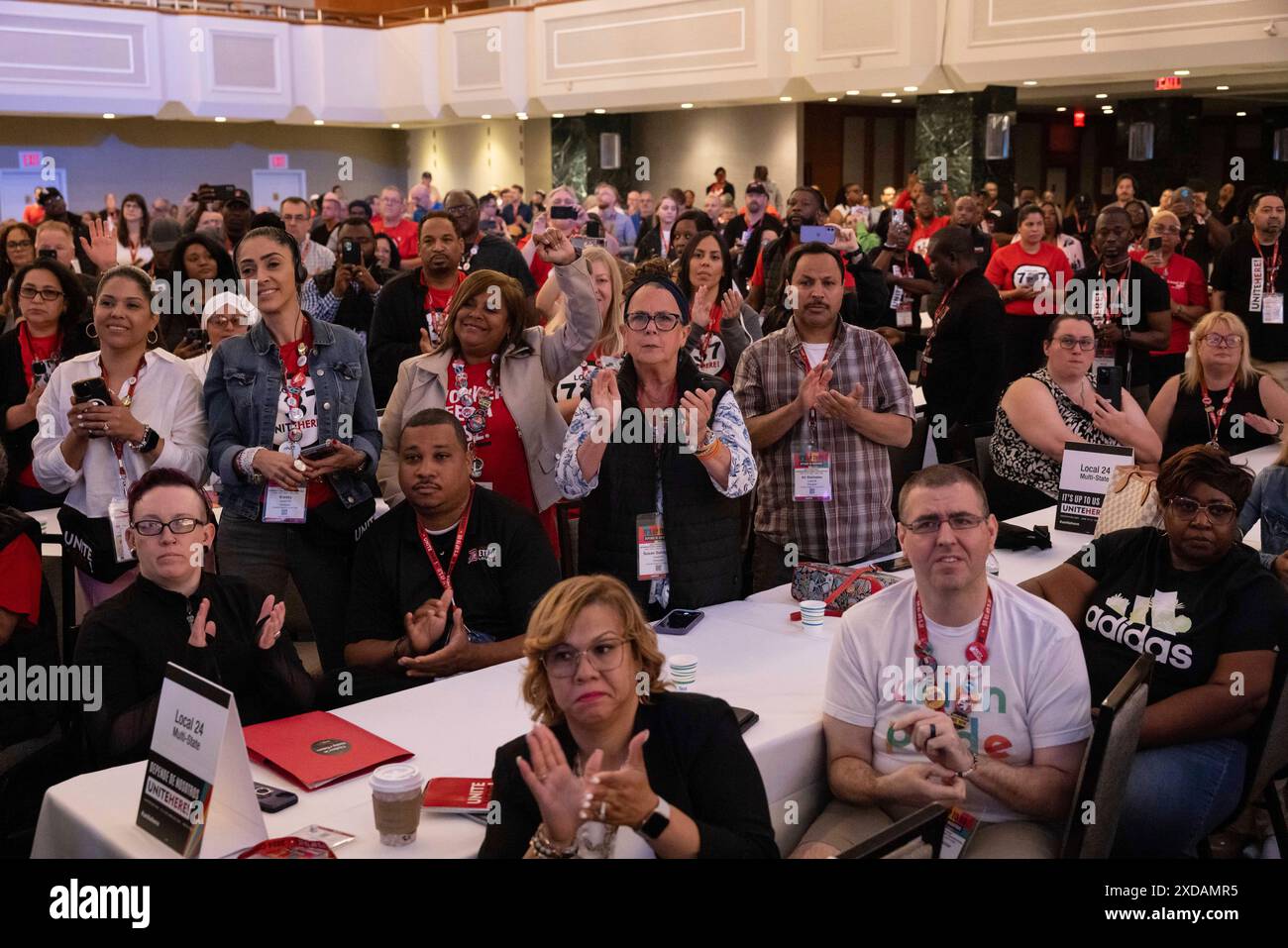 Members of union workers wait for Vice President Kamala Harris' speech ...